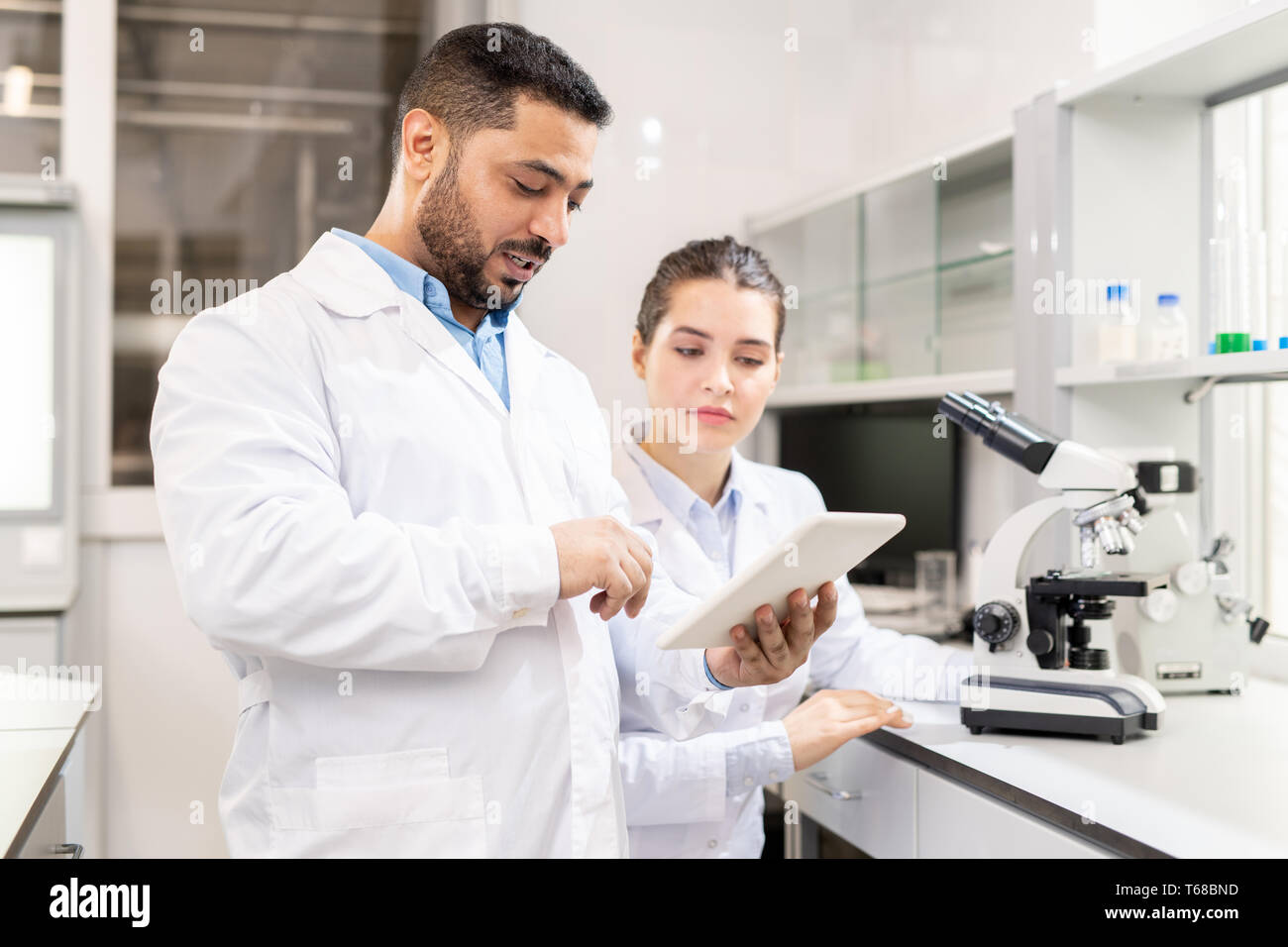 Examining test solution on tablet Stock Photo - Alamy