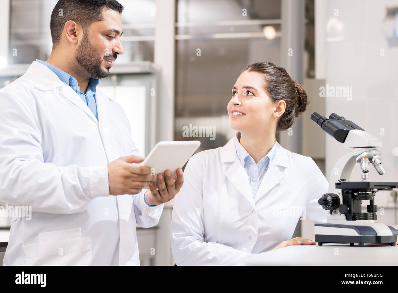 Laboratory scientists working on research project Stock Photo - Alamy