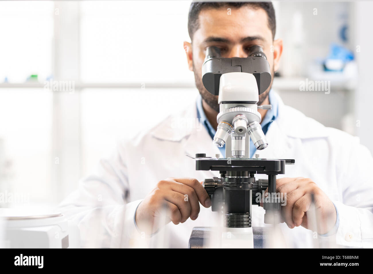 Adjusting microscope hi-res stock photography and images - Alamy