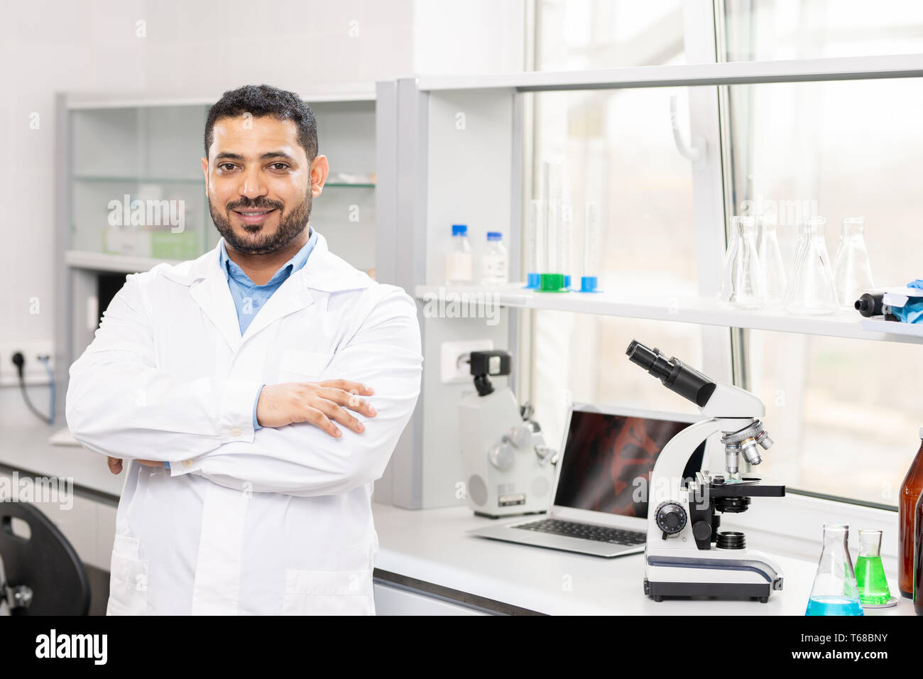 Content young Arabian scientist in laboratory Stock Photo - Alamy