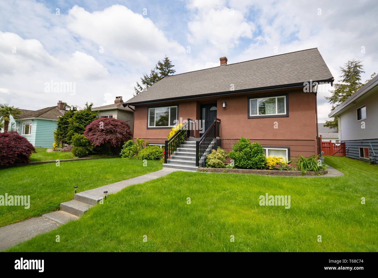 Average brown residential house built on land terrace Stock Photo - Alamy