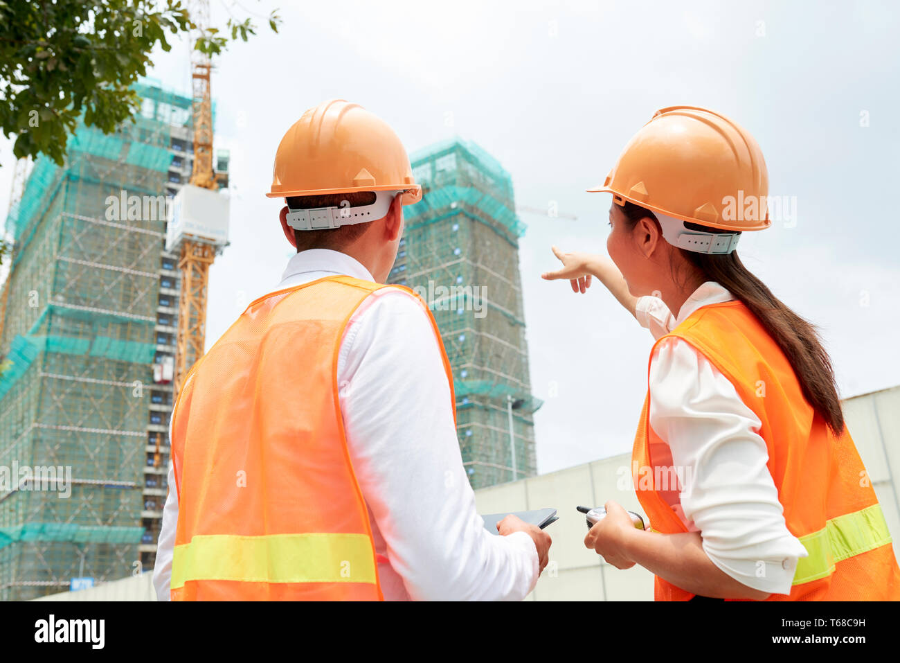 Business people observing the construction Stock Photo - Alamy