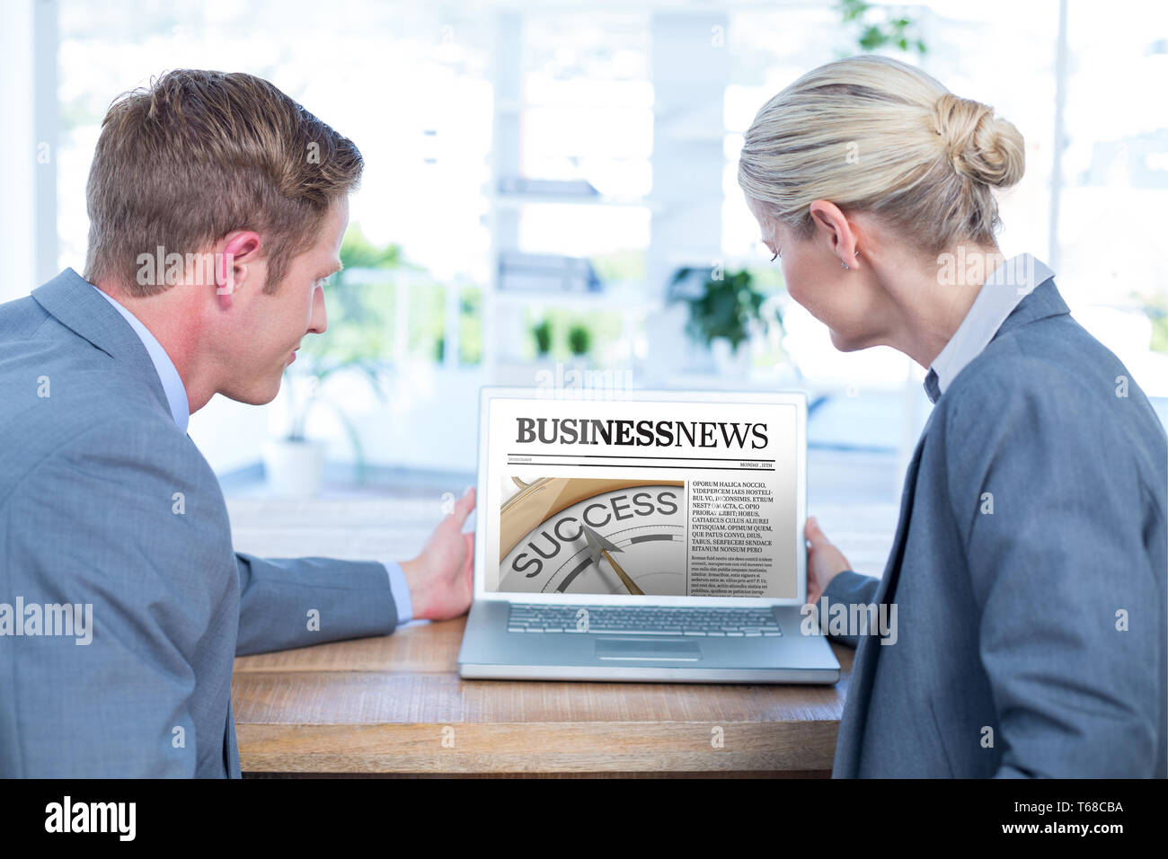 Composite image of business people looking at blank screen of laptop ...