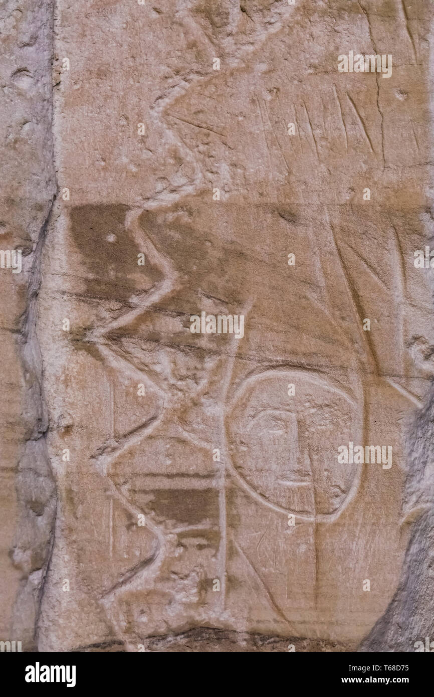 Petroglyphs, including face and snake designs, carved by Ancestral ...
