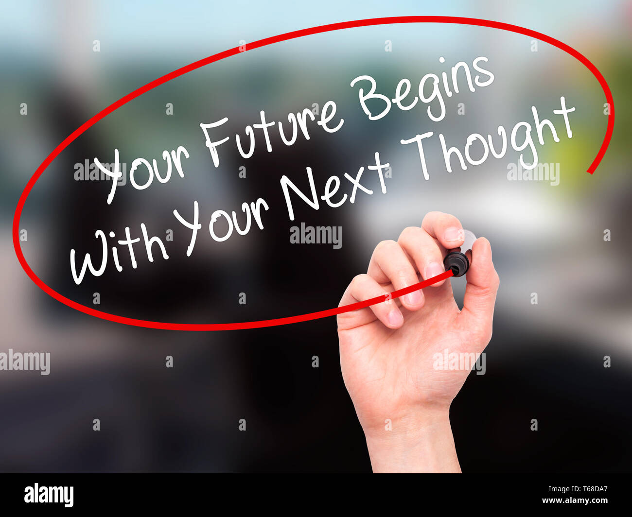 Man Hand writing Your Future Begins With Your Next Thought with black ...
