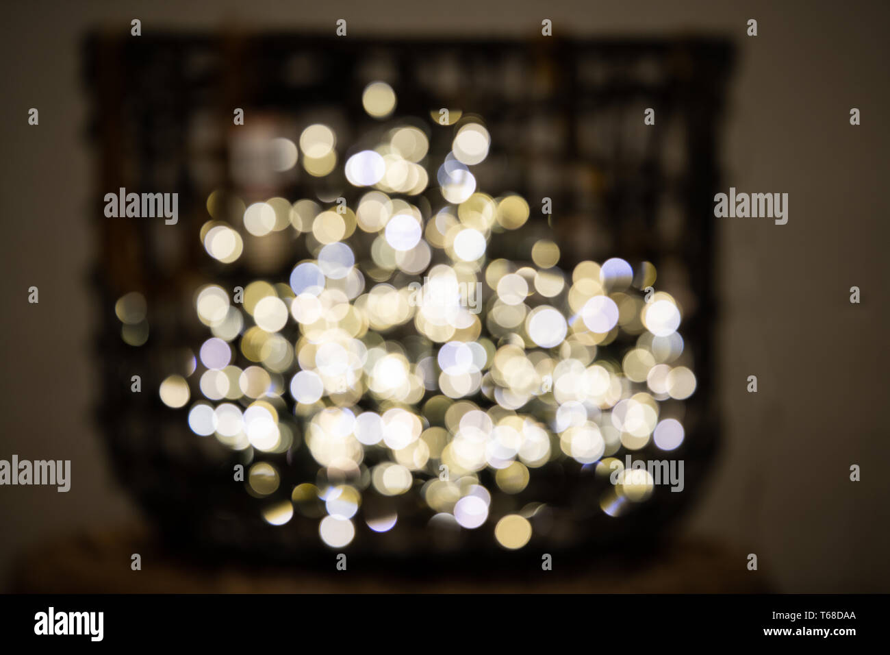 Decorative colored fairy lights blurred with larger bokeh - on display ...