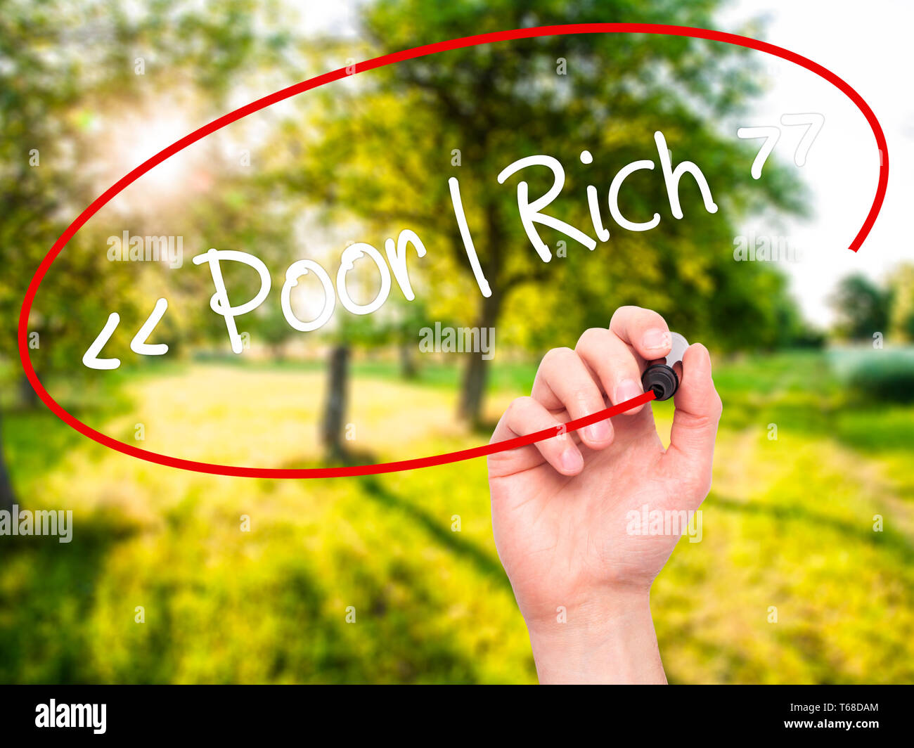 Man Hand writing Poor - Rich with black marker on visual screen Stock ...