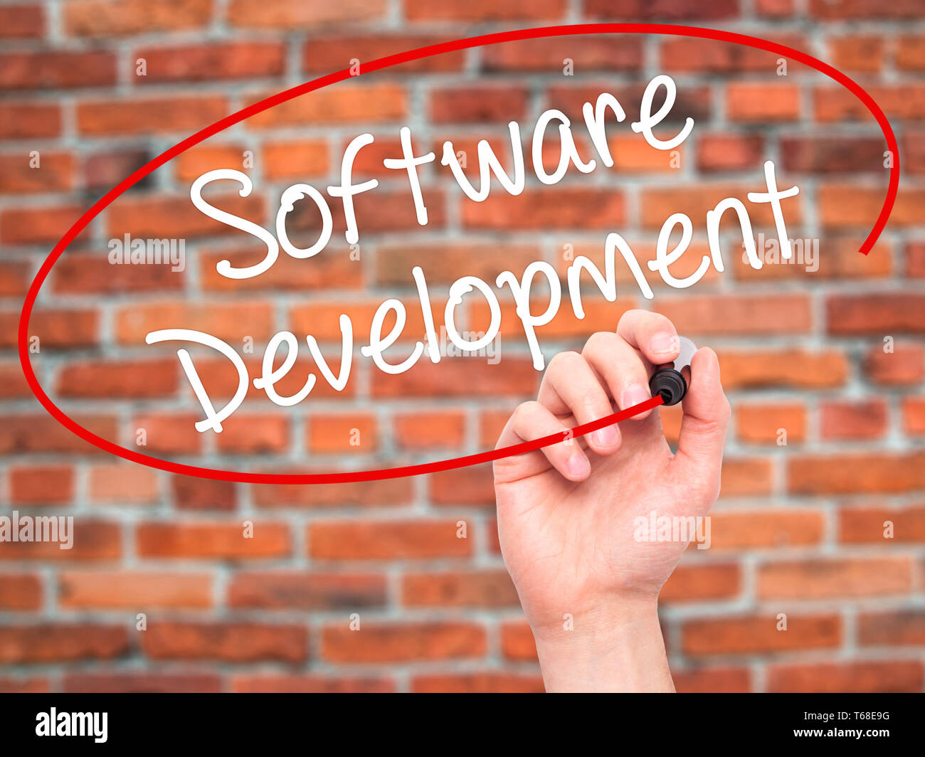 Man Hand writing Software Development with black marker on visual ...