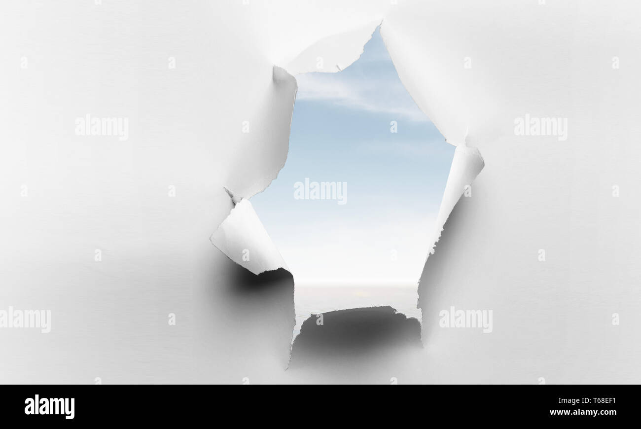 Effect of torn paper hole Stock Photo - Alamy