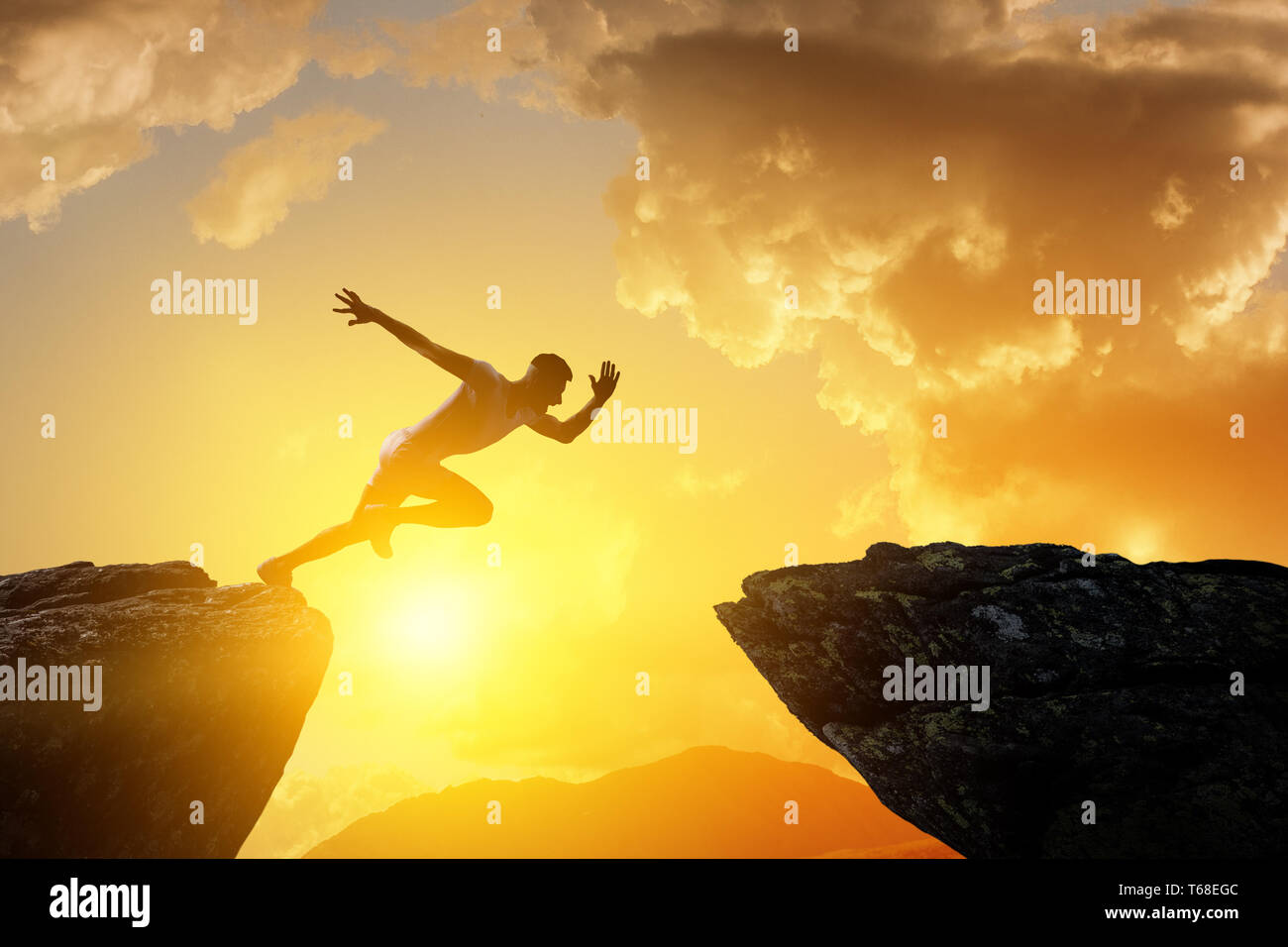 Man jumping over rocks hi-res stock photography and images - Alamy