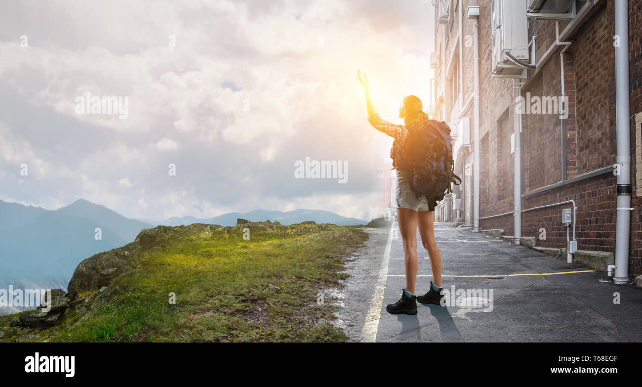 Travelling female tourist with backpack Stock Photo - Alamy