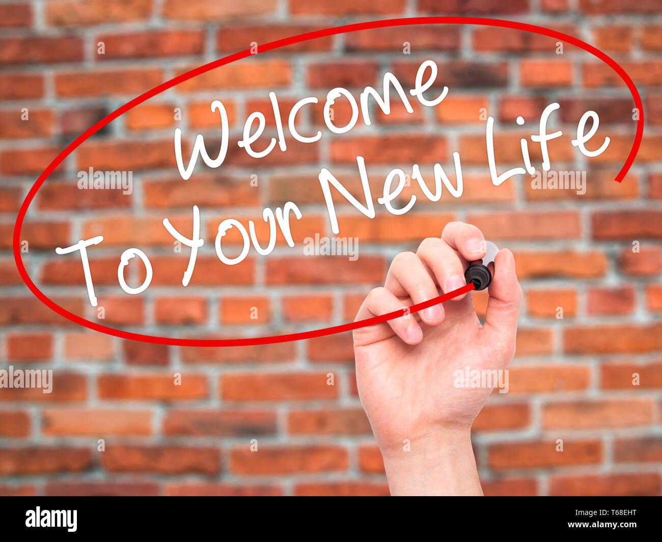 Man Hand writing Welcome To Your New Life with black marker on visual ...