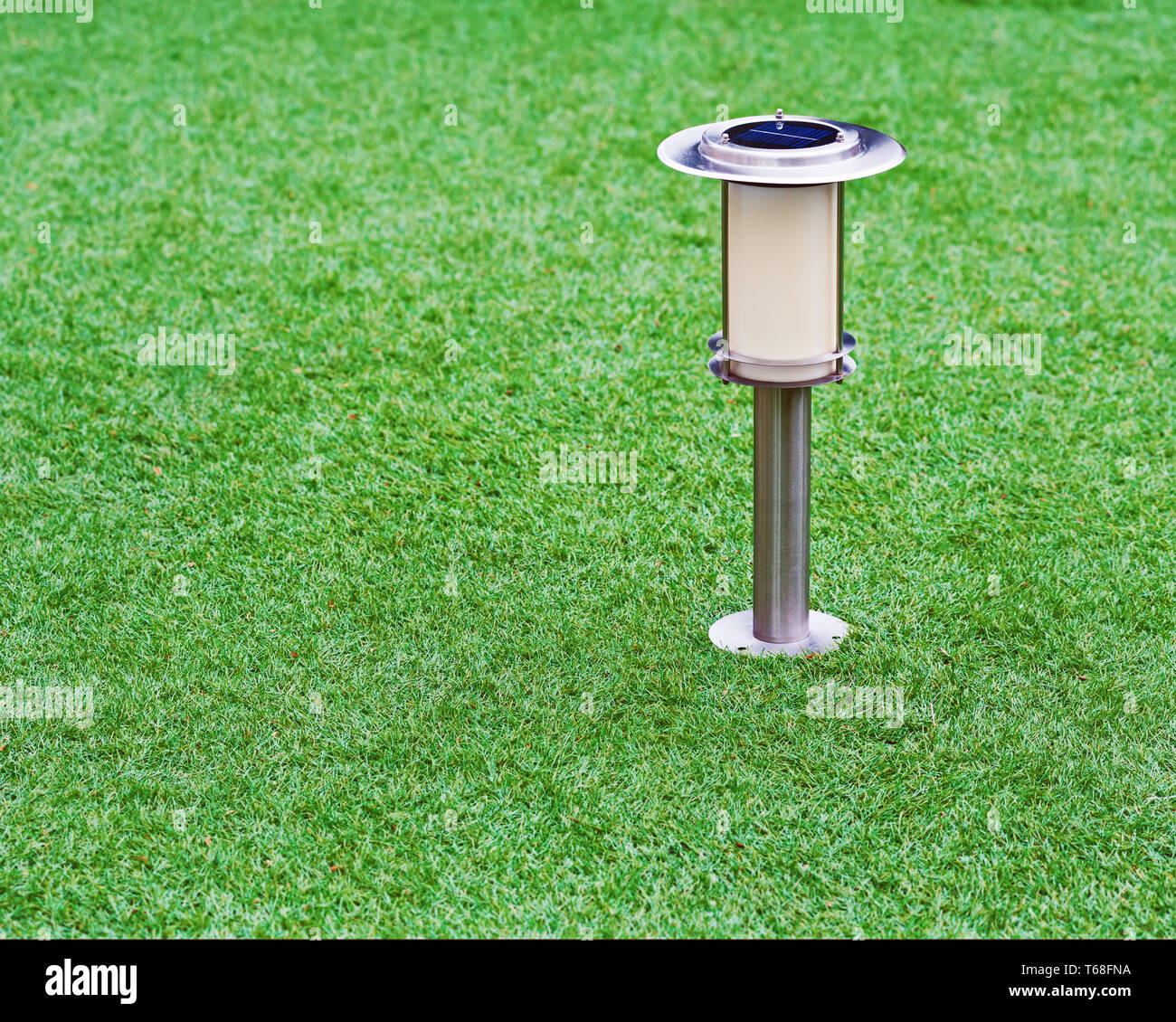 Solar-powered lamp on garden background Stock Photo - Alamy