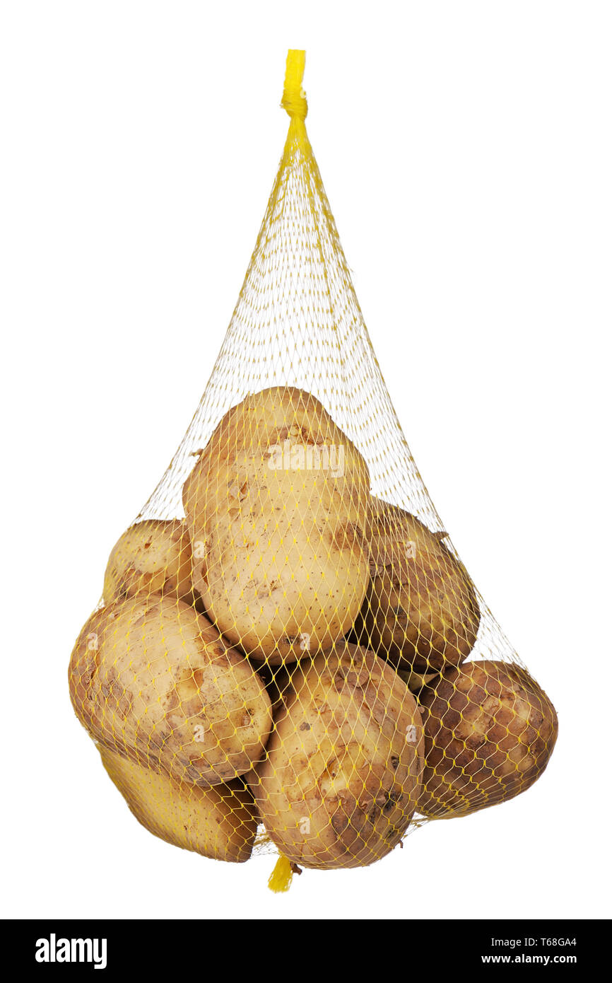 Crude organic potatoes in mesh bag isolated on white background Stock ...