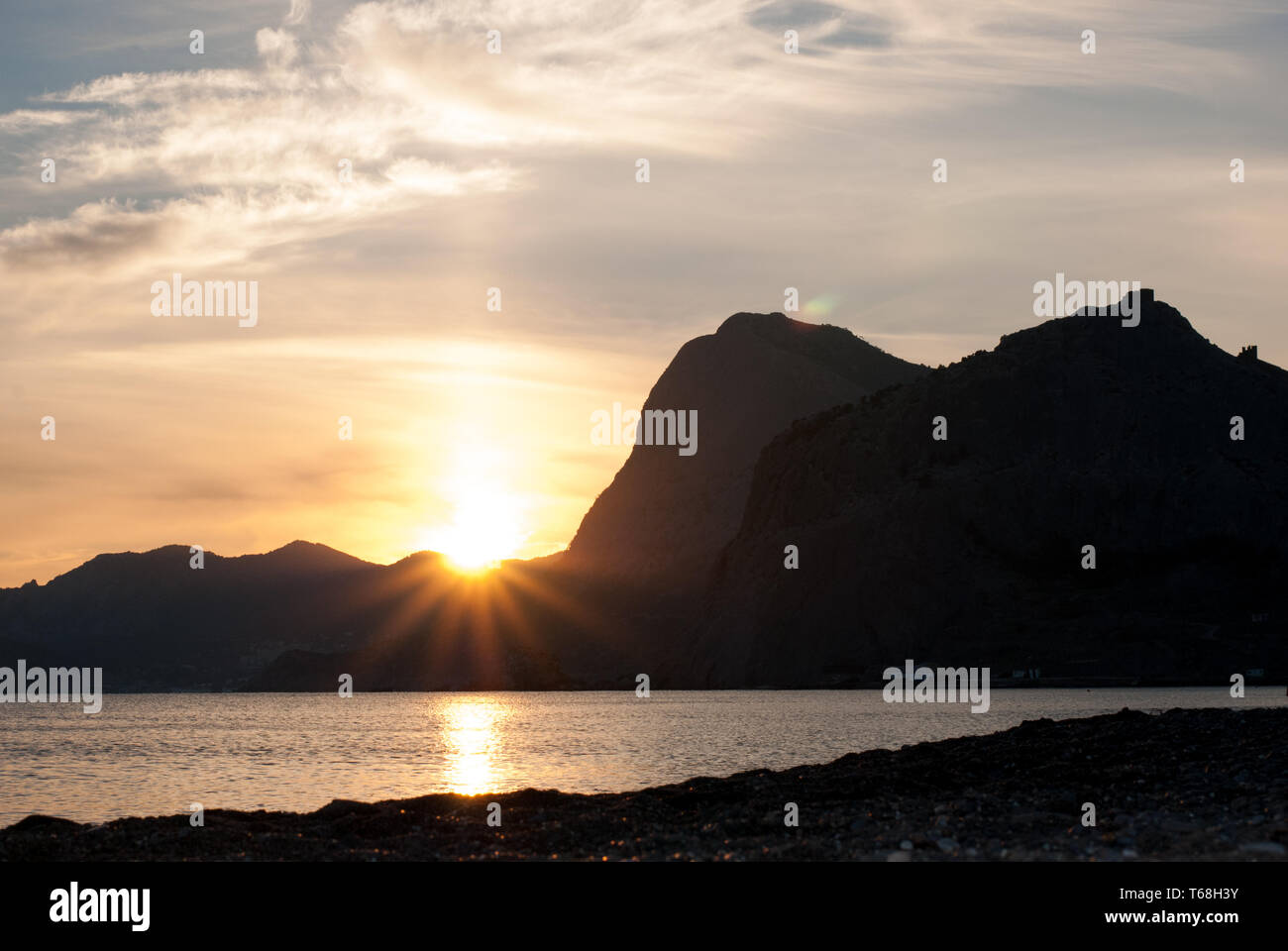 Beautiful bright sunset on the Black Sea in the Sudak. Seaside with ...