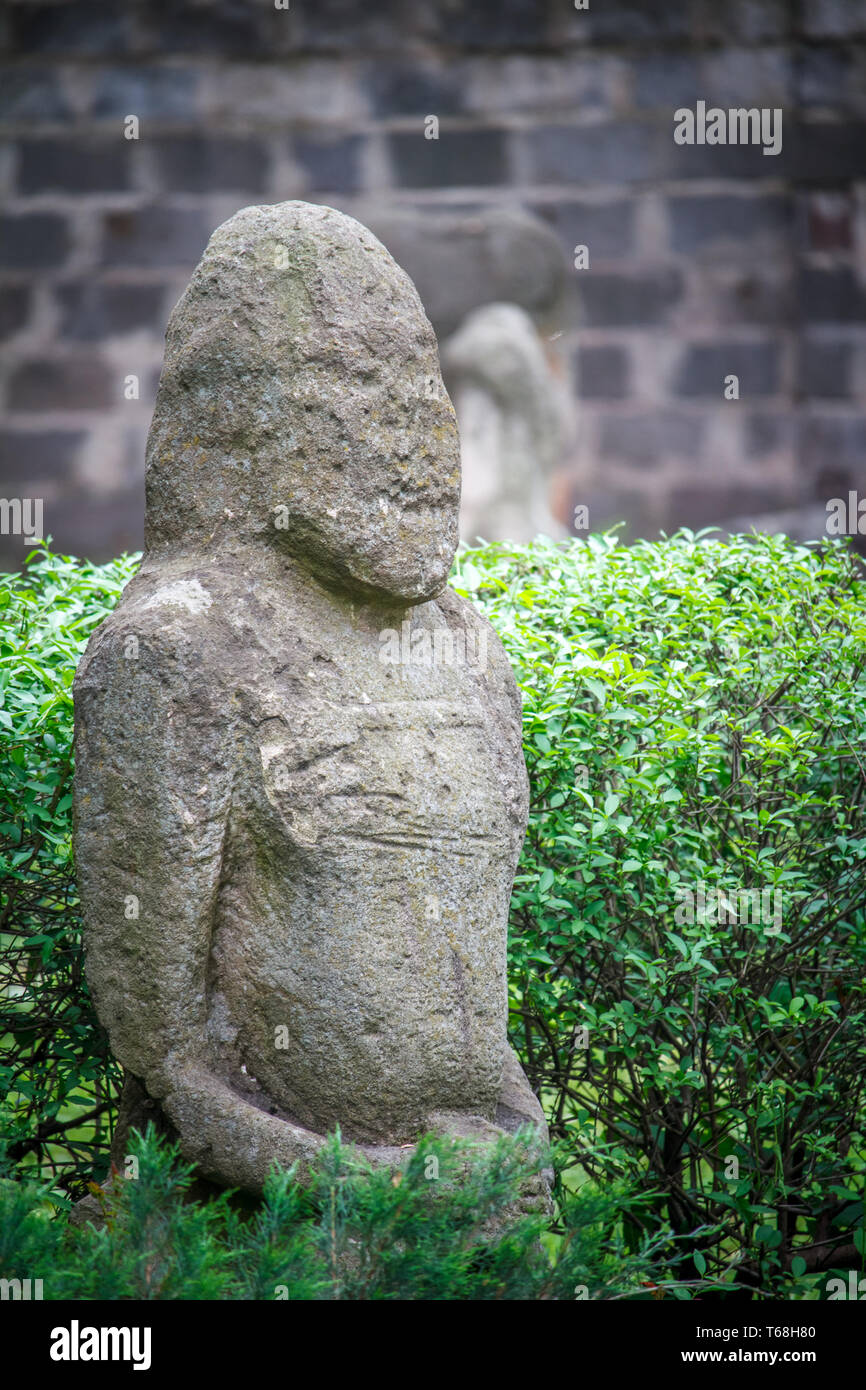 Ancient statue of Polovtsian stone woman or boundary stone in the city ...