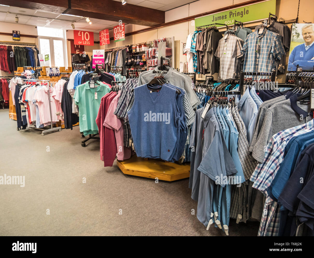Colourful displays of mens ware on display at a town centre department ...