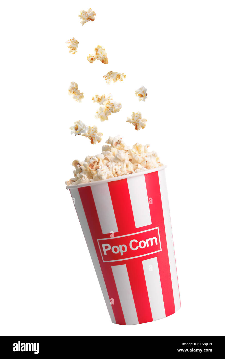 Tasty popcorn falling into cup on white background Stock Photo - Alamy