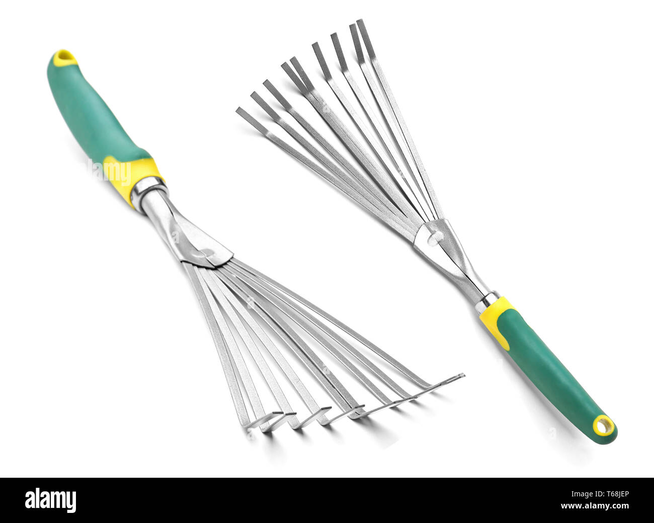 Metal rakes for gardening on white background Stock Photo - Alamy