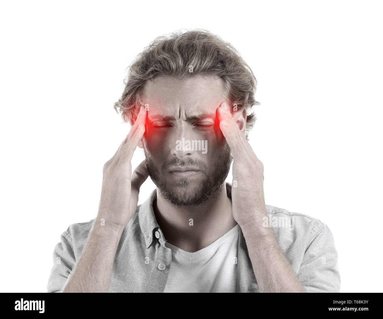 Stressed man suffering from headache on white background Stock Photo ...