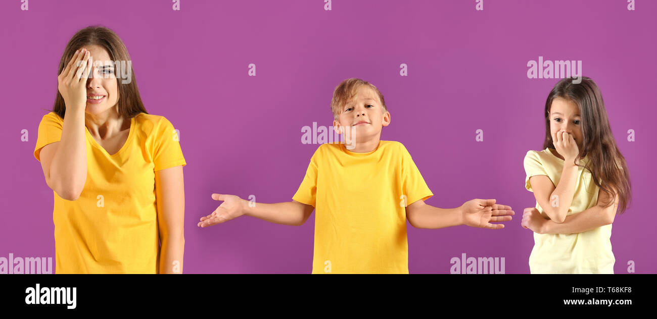 Emotional woman and children after making mistake on color background ...