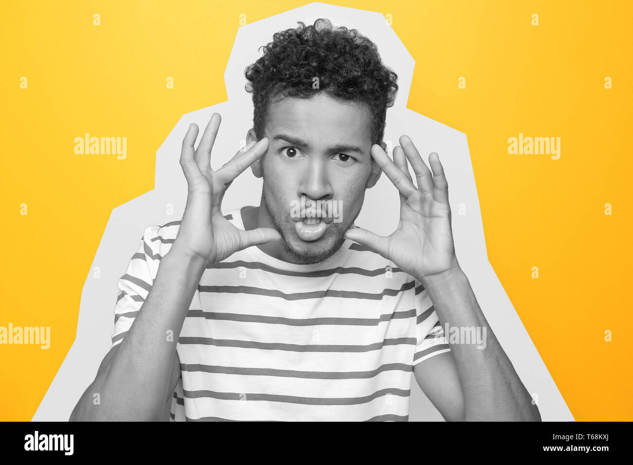 Portrait of crazy African-American man on color background Stock Photo ...