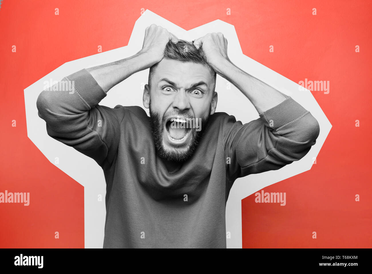 Portrait of aggressive man on color background Stock Photo - Alamy