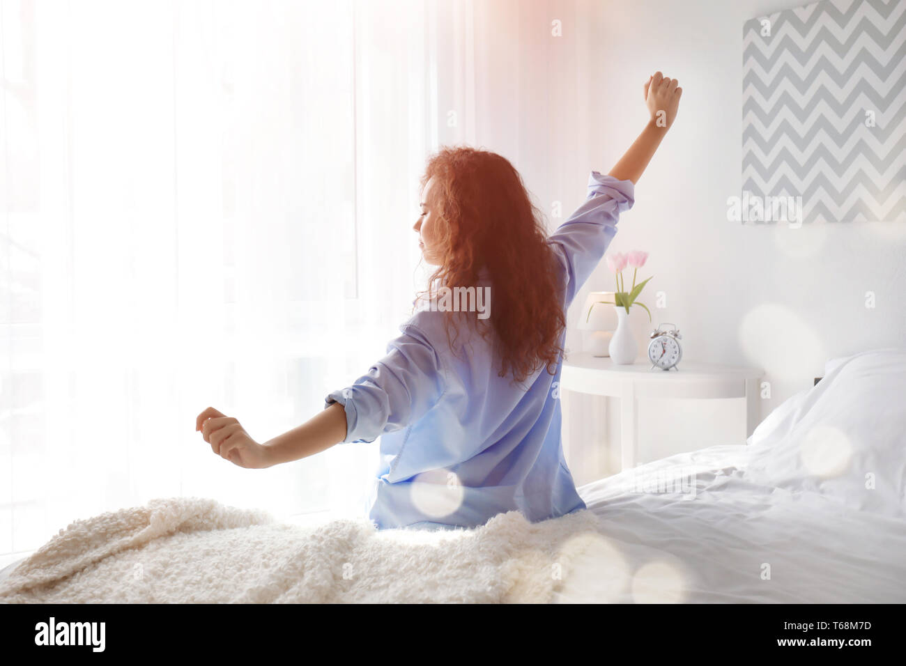 Morning of beautiful young woman in bedroom Stock Photo - Alamy
