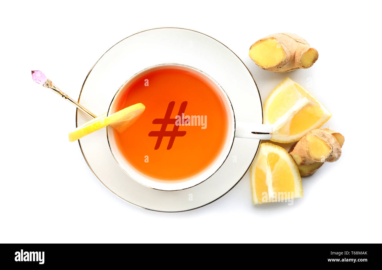 Cup of delicious tea with hashtag symbol on white background Stock ...