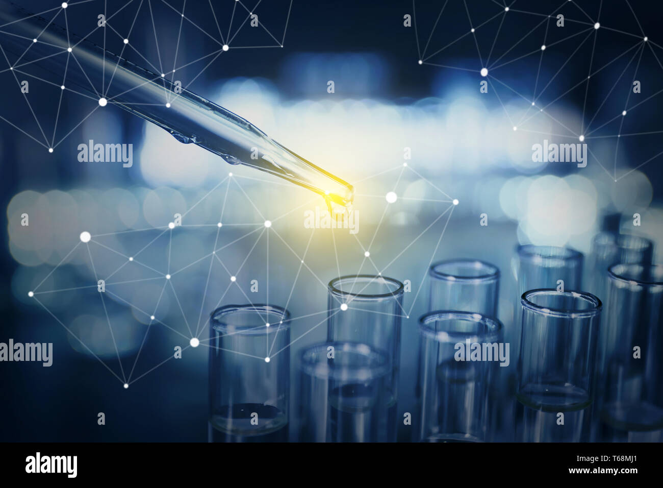 Dripping of liquid from dropper into test tubes, closeup Stock Photo ...