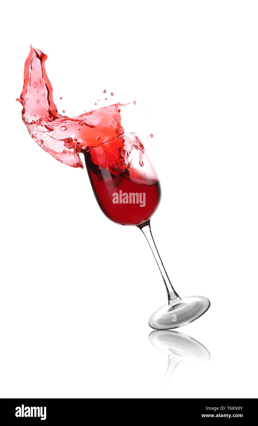 Falling glass with red splashing wine on white background Stock Photo ...