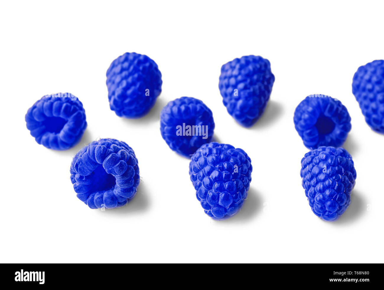 Fresh ripe blue raspberry on white background Stock Photo - Alamy