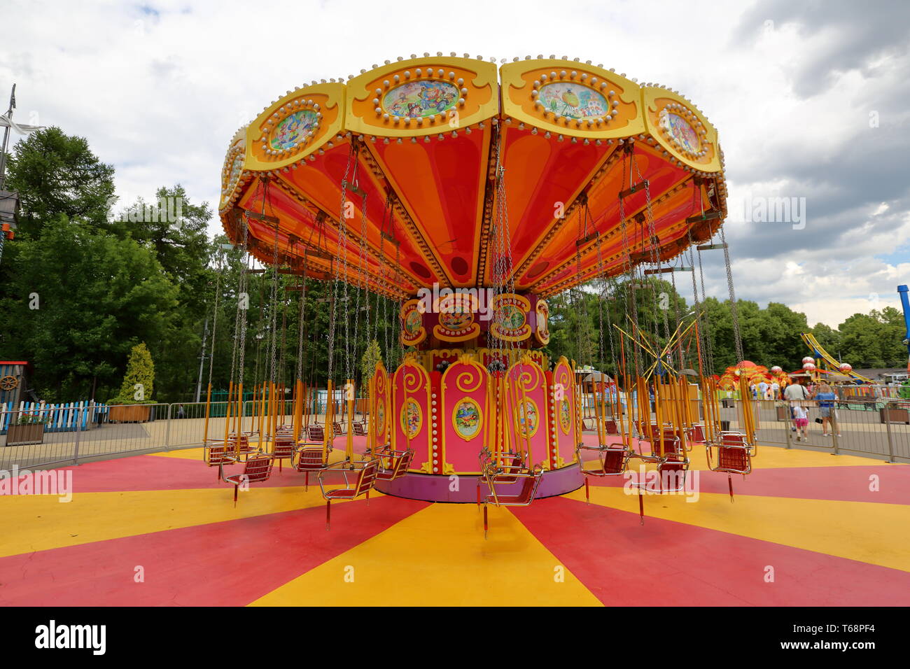 Carousel at amusement park Stock Photo - Alamy