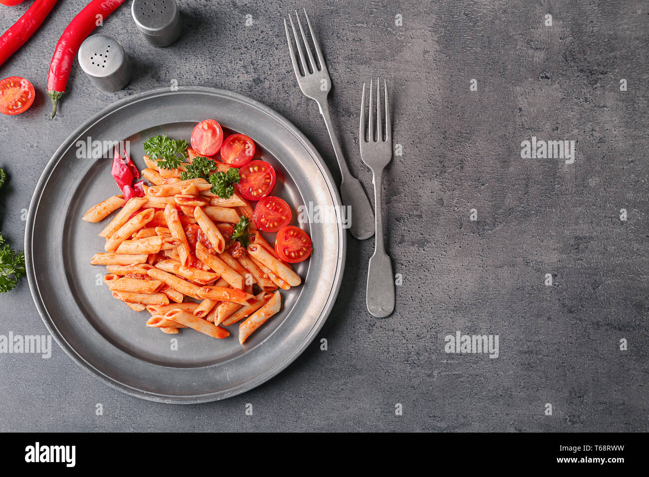 Plate of tasty pasta with tomato sauce on table, top view Stock Photo ...