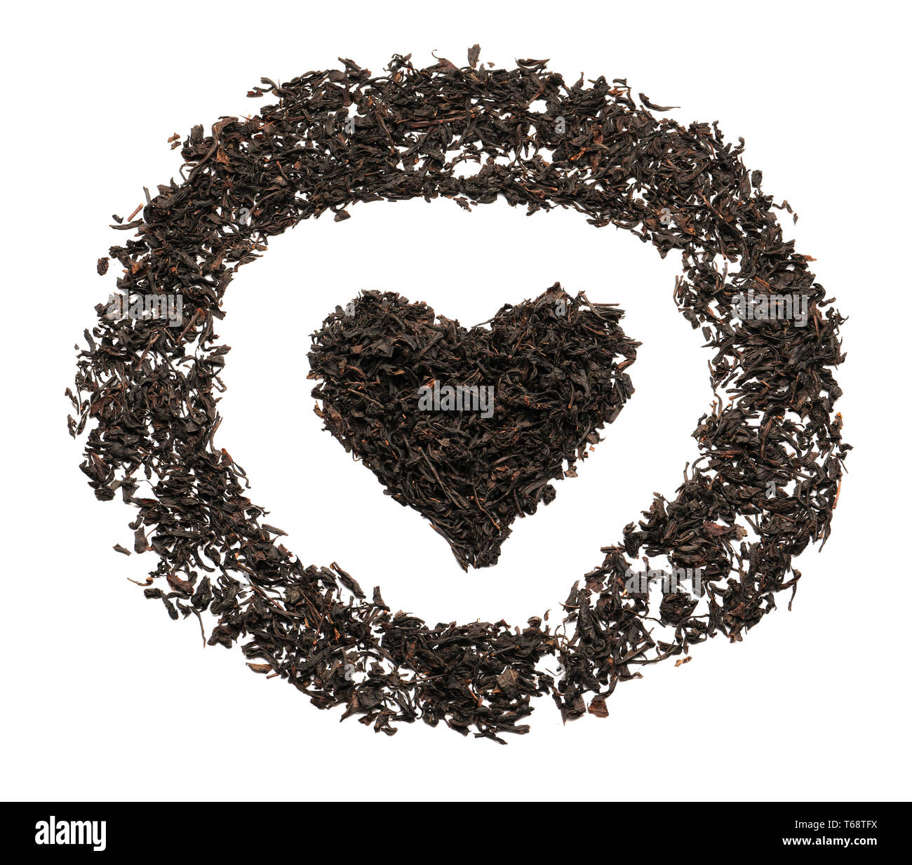 Heart and circle made of dry black tea leaves on white background, top ...