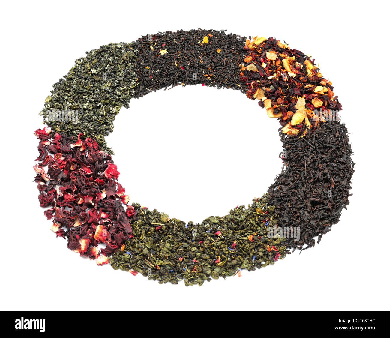 Circle made of different types of dry tea leaves on white background ...