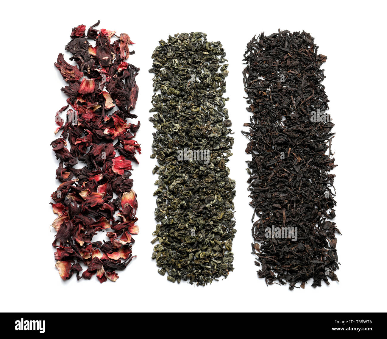 Different types of dry tea leaves on white background Stock Photo - Alamy
