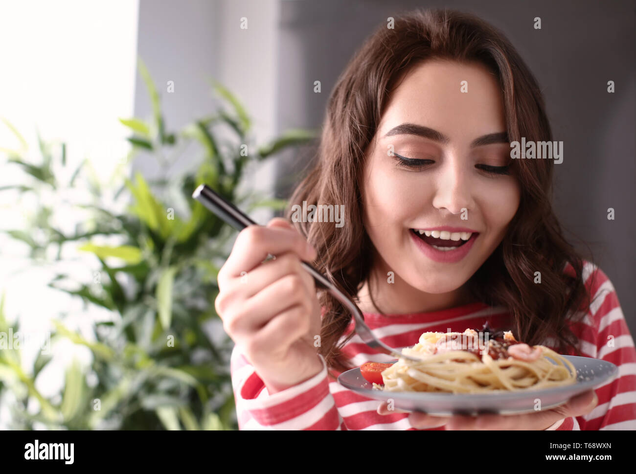 Adult eating pasta with appetite hi-res stock photography and images ...