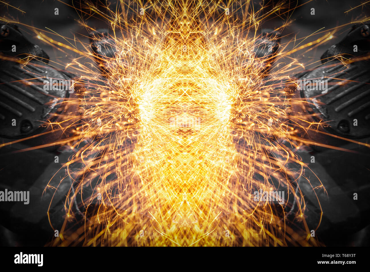 Bright orange and yellow sparks on a black background. A stream of ...