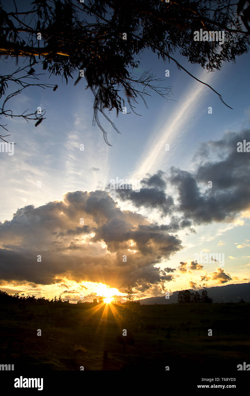 Multiple exposure of the sun on the edge of a Andean mountain at the ...