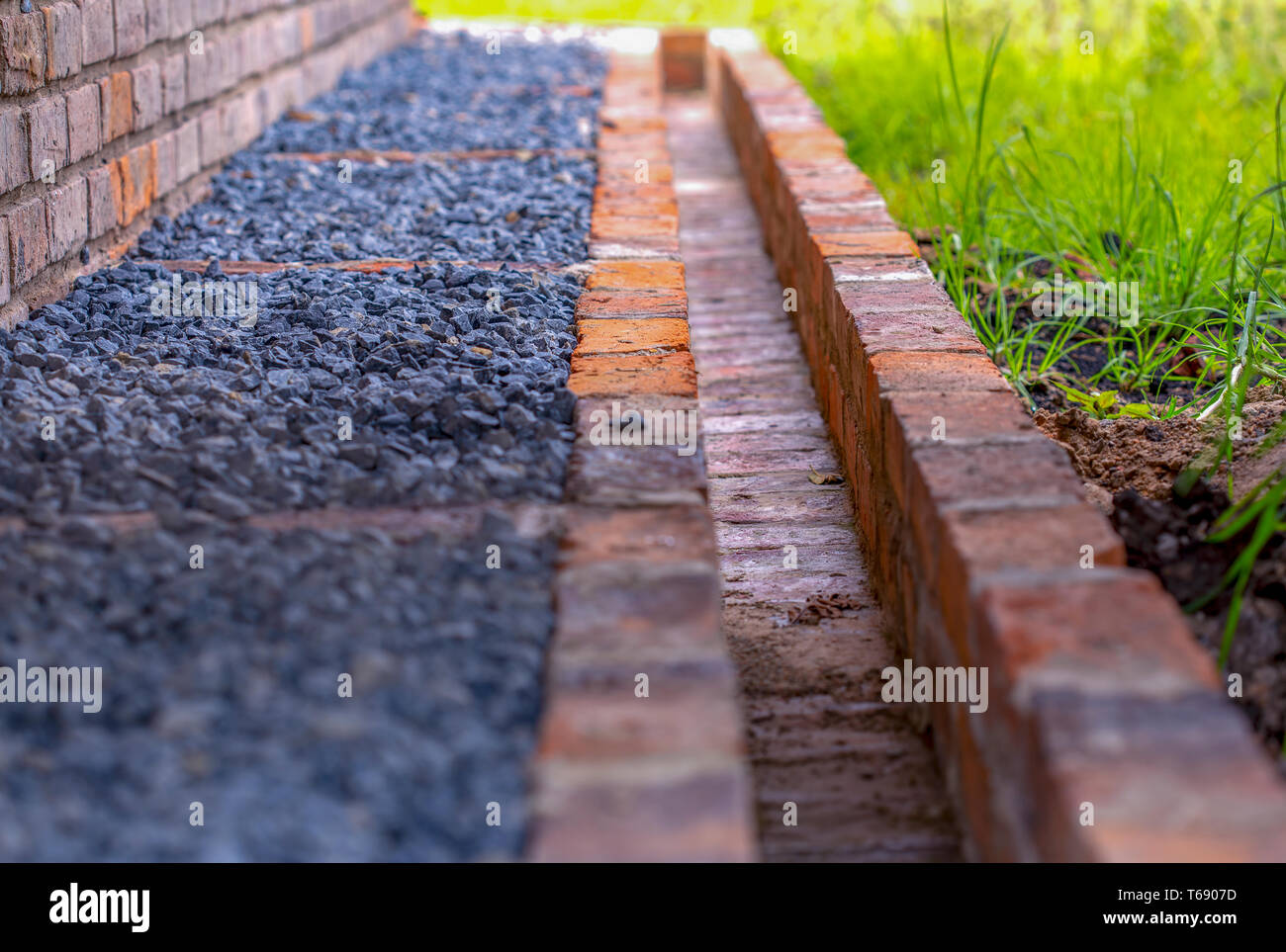 Photography of part of a drain system around a country house made with ...