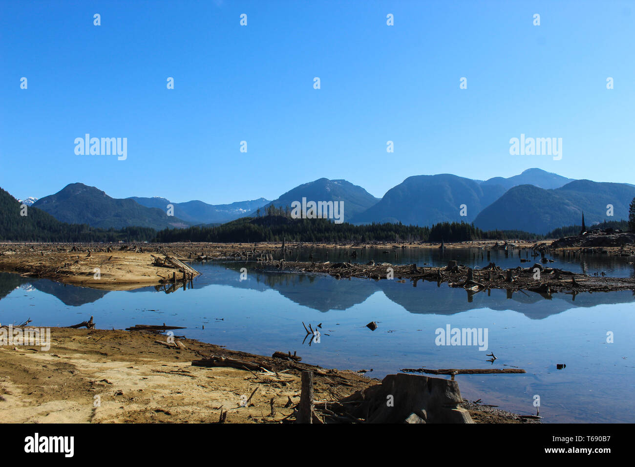 Surface of Stave lake reflecting mountains Stock Photo - Alamy