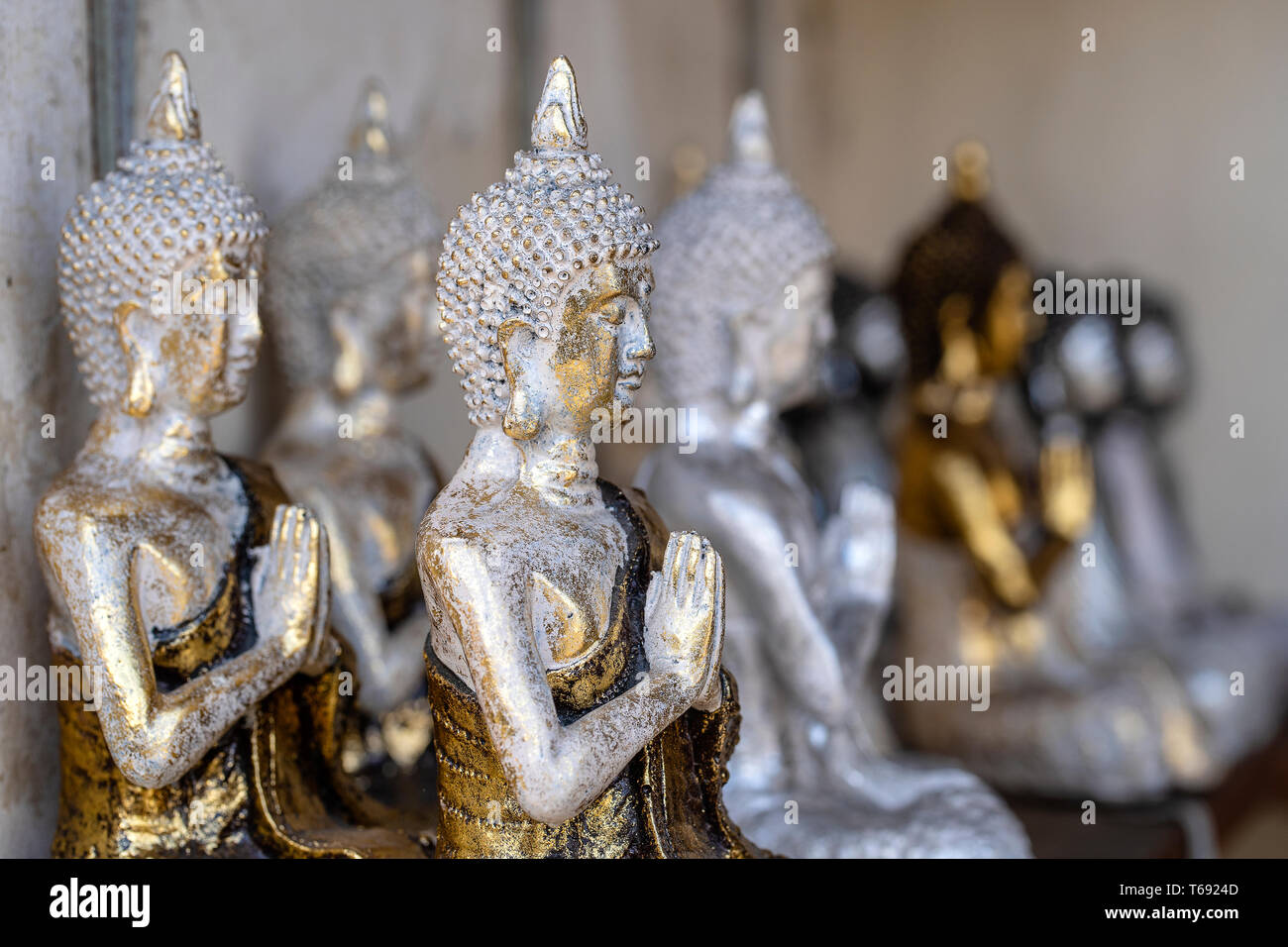 Buddha statue figures souvenir on display for sale on street market in ...