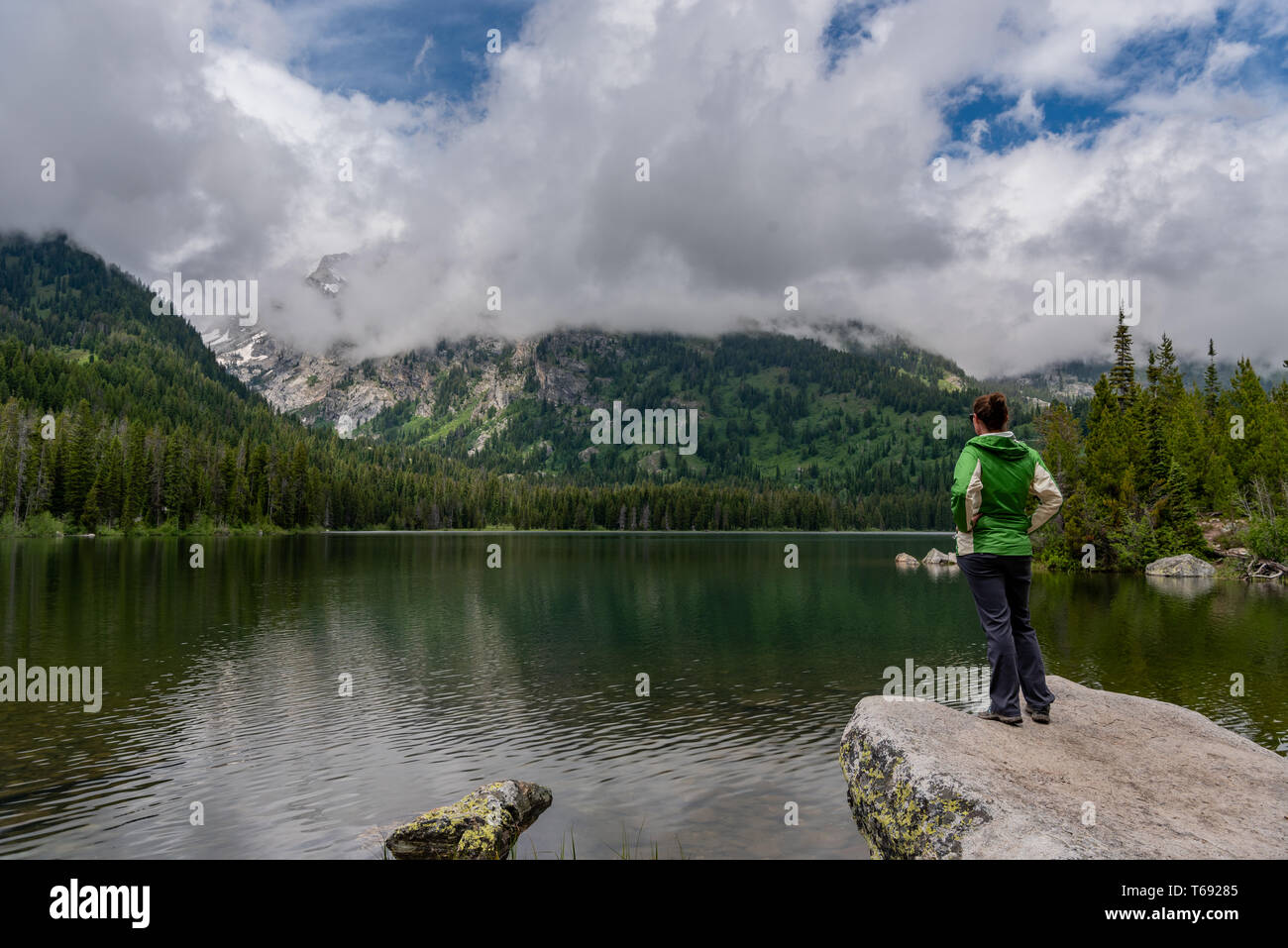 Woman looking out over lake summer hi-res stock photography and images ...