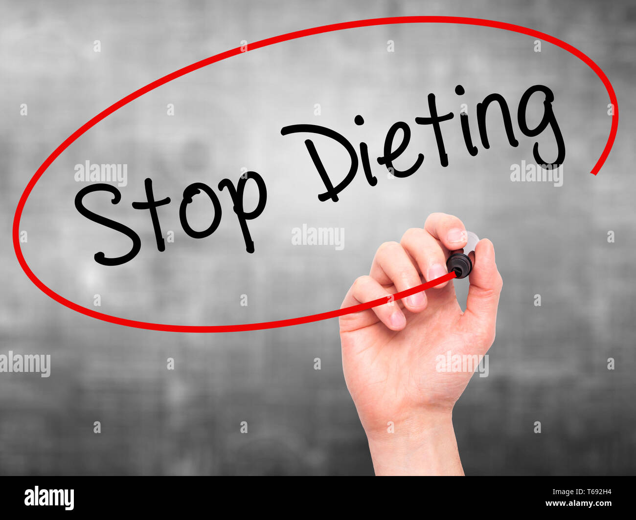 Man Hand writing Stop Dieting with black marker on visual screen Stock ...