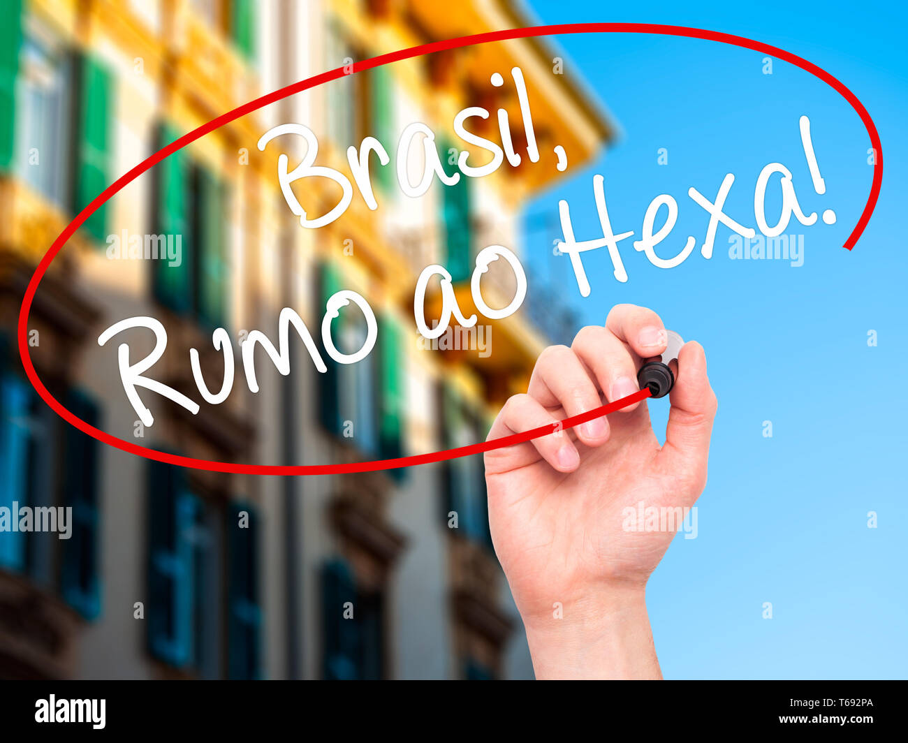 Man Hand writing Brasil, Rumo ao Hexa! with black marker on visual ...