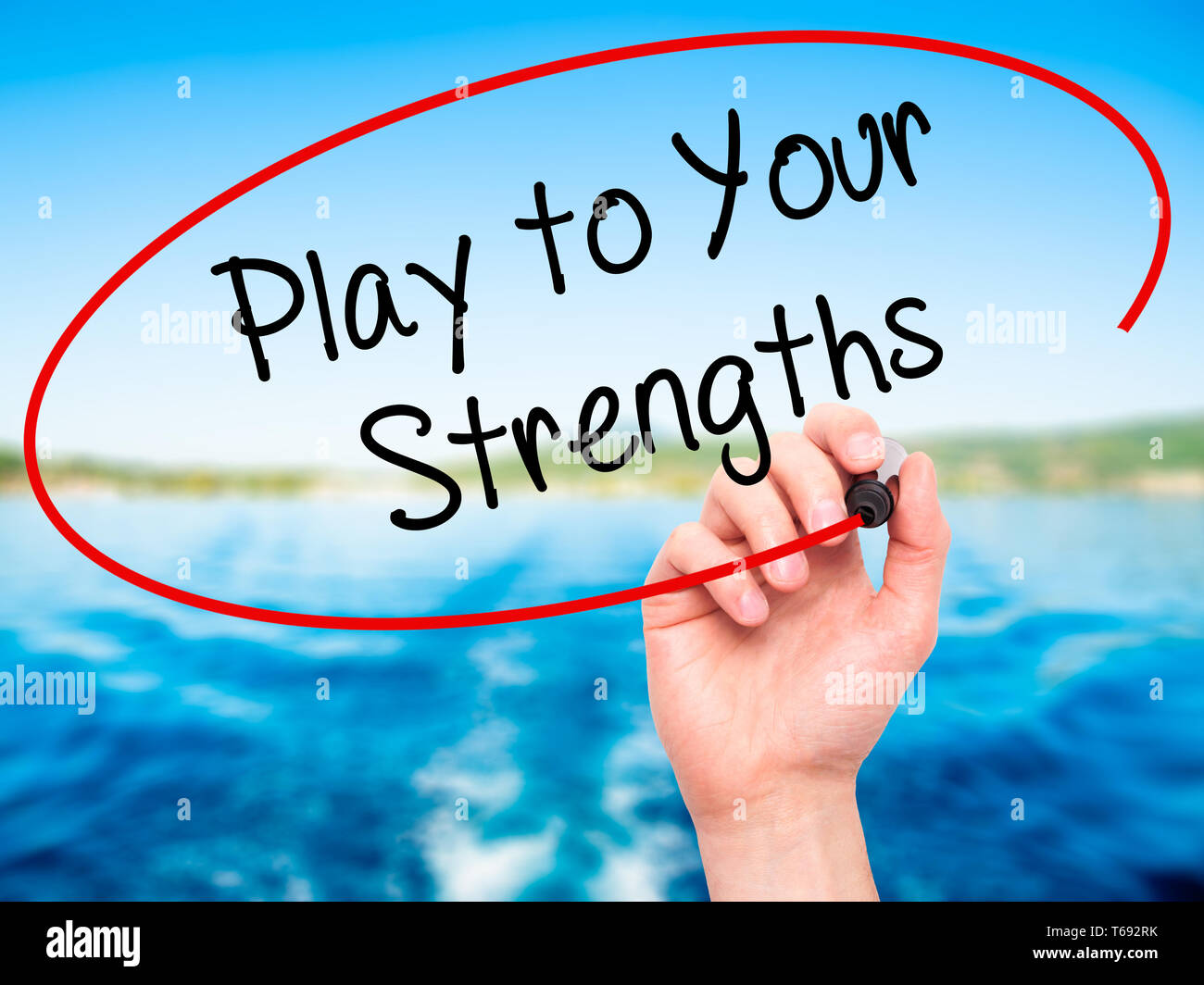 Man Hand writing Play to Your Strengths with black marker on visual ...