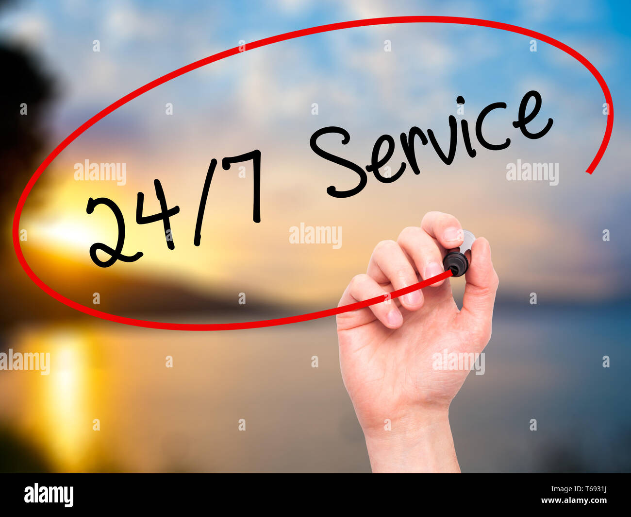 Man Hand writing 24/7 Service with black marker on visual screen Stock ...