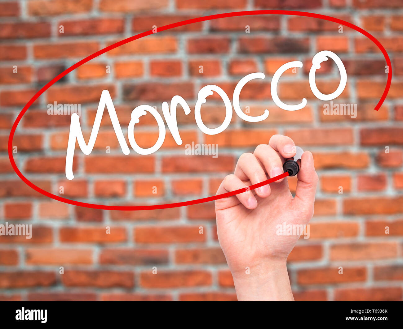 Man Hand writing Morocco with black marker on visual screen Stock Photo ...