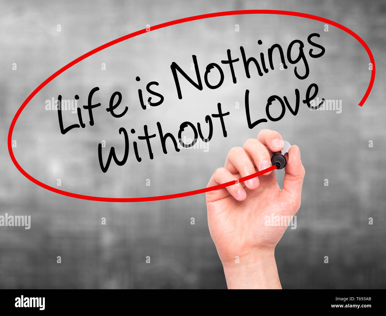 Man Hand writing Life is Nothings Without Love with black marker on ...